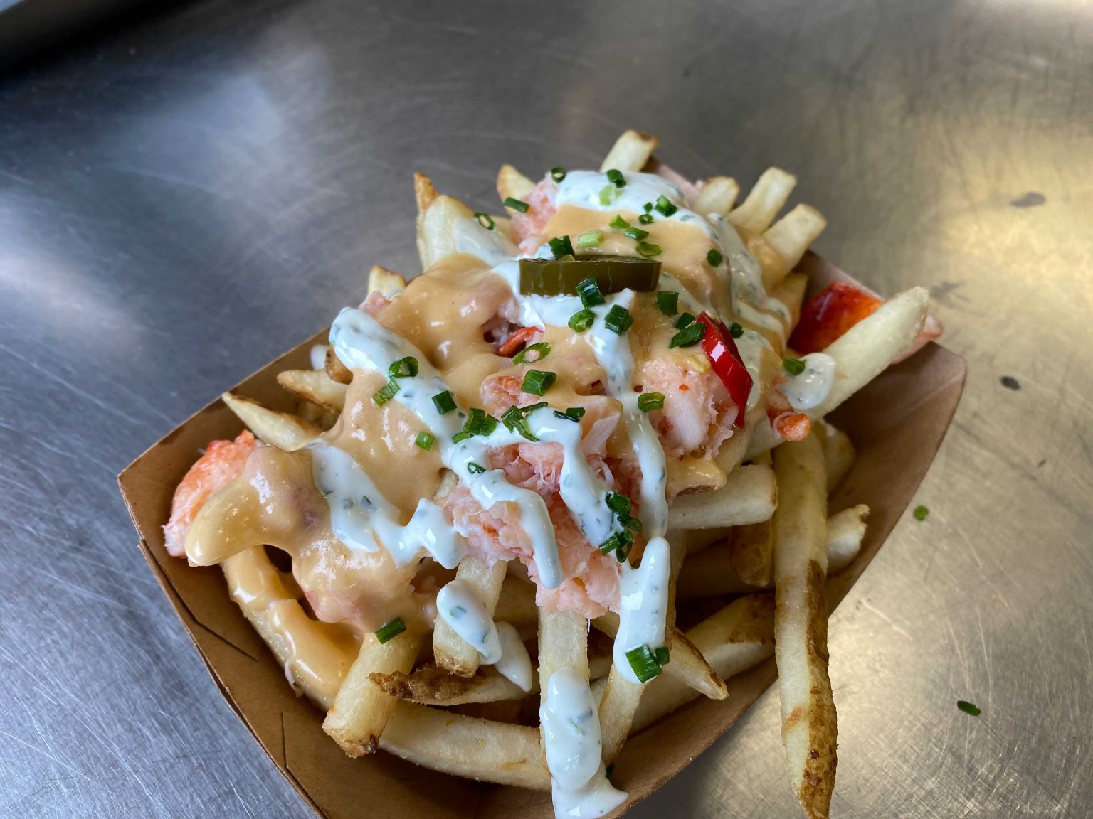 REVIEW – Lobster Poutine at EPCOT Should Just Be Called Lobster Fries ...